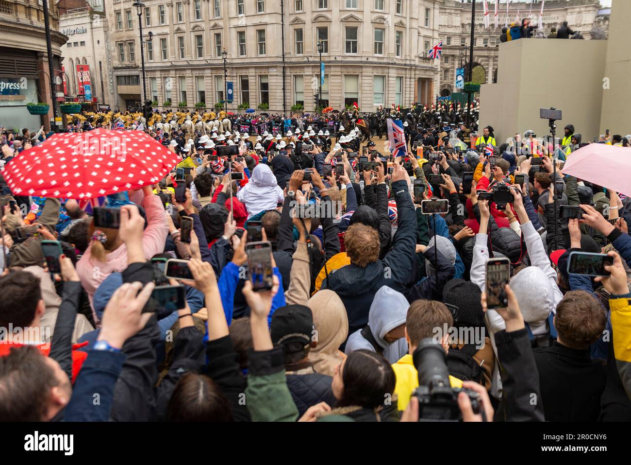 Crowds of people watching the Royal Procession of the Coronation of ...