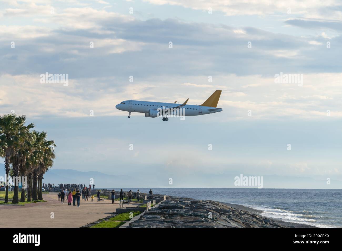 Plane landing over sea hi-res stock photography and images - Alamy