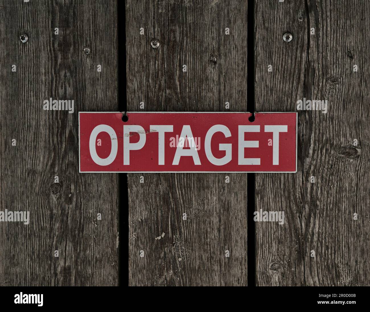 Closeup of a vibrant red occupied sign with a vivid hue, indicating a ...