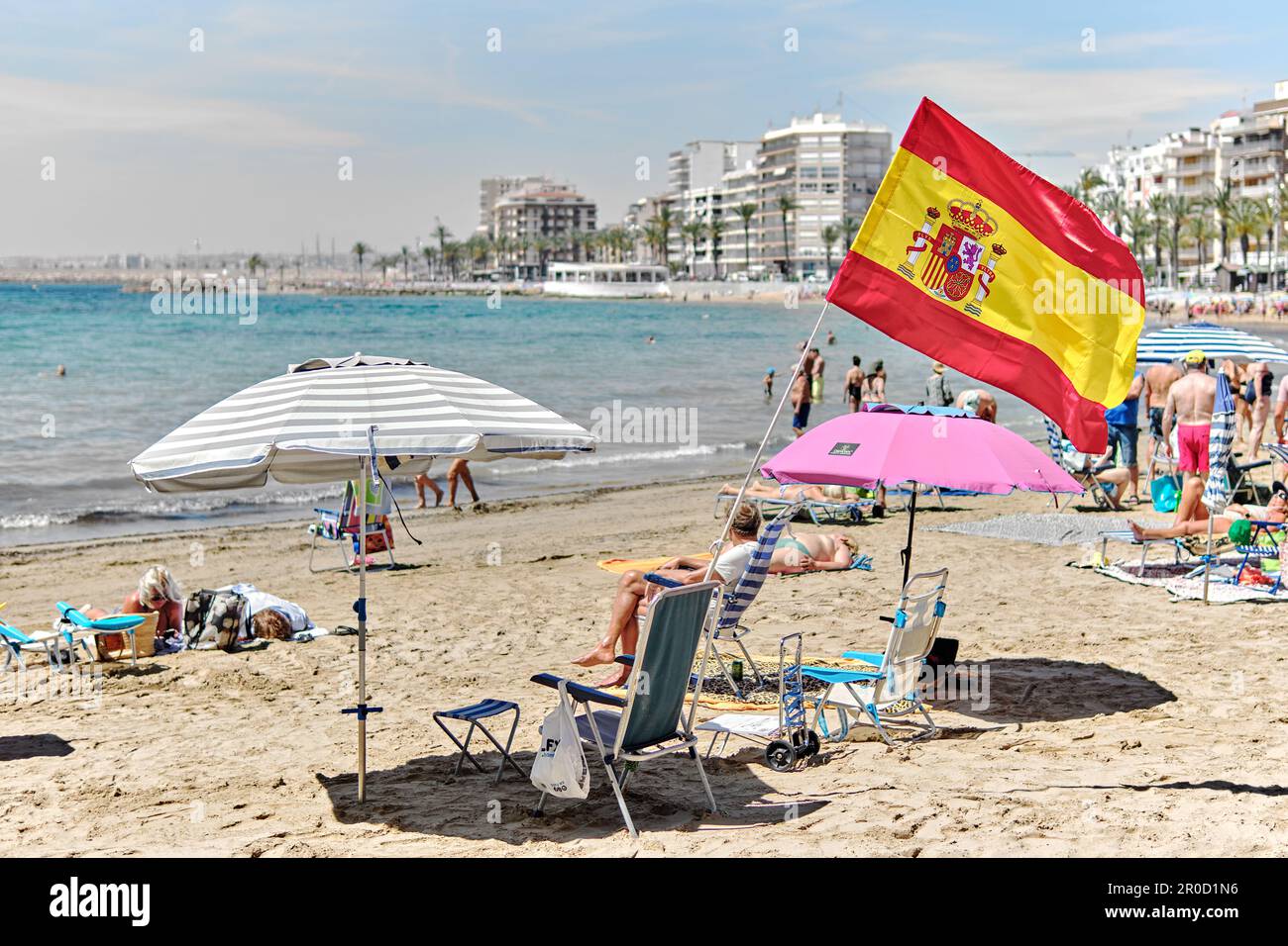 Torrevieja, Spain - April 25, 2023: People relaxing on the sandy beach ...