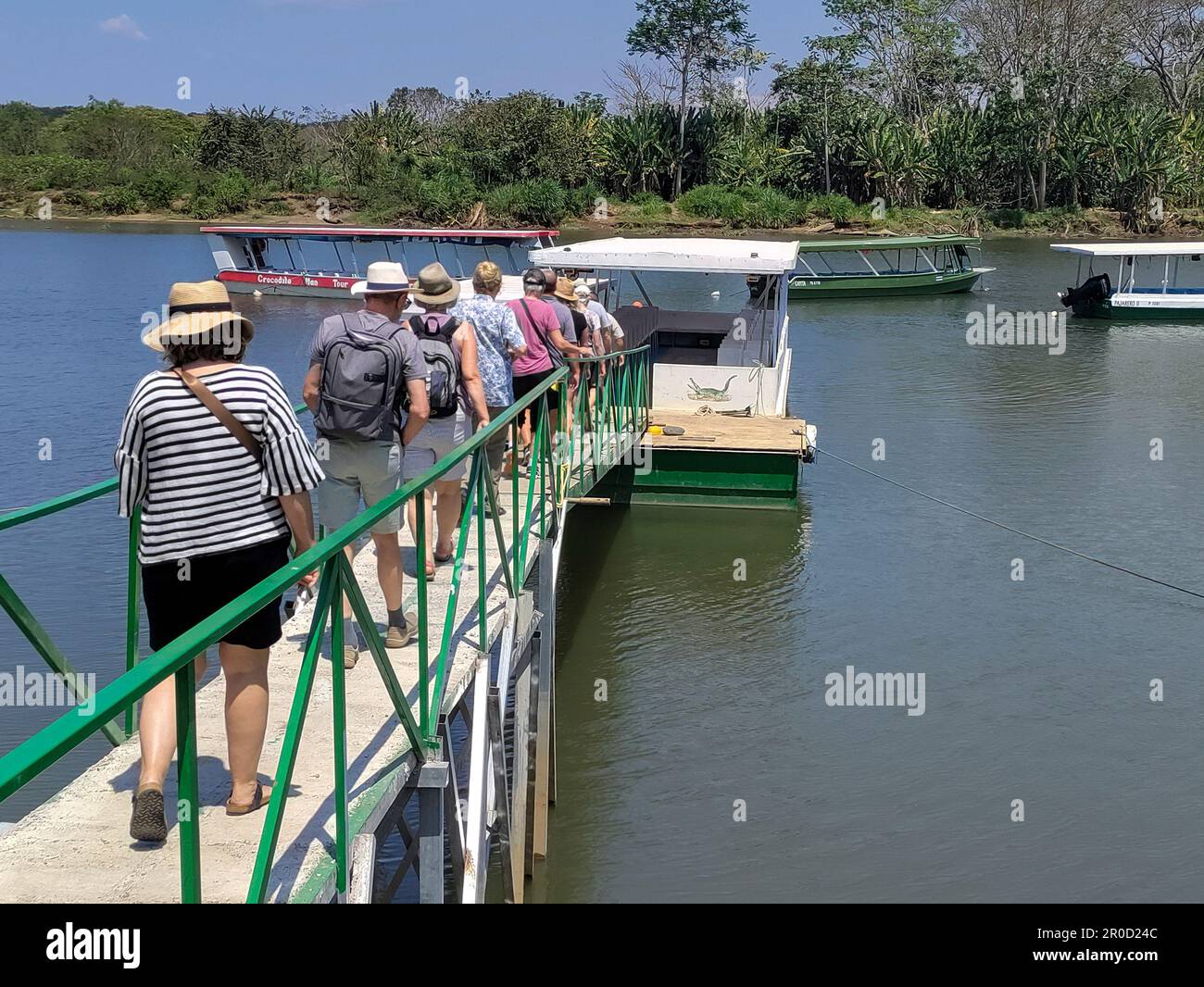 Tarcoles, Costa Rica - Tourists board a boat for a crocodile watching ...