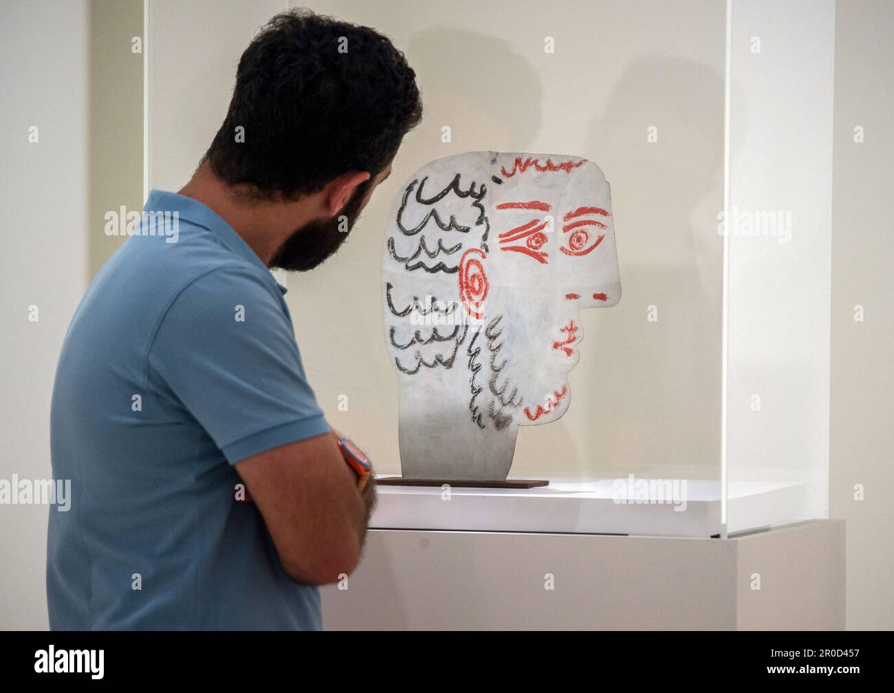 A worker looks at a sculpture during the presentation of the new ...