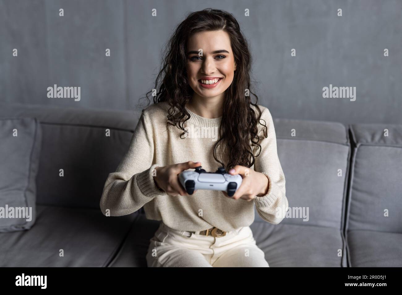 Hot-tempered concentrated pretty brunette young lady in casual outfit ...