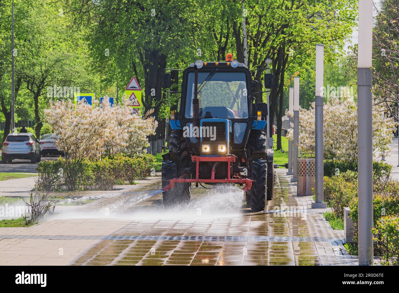 Cleaning machine washes the city street early in the morning Stock ...