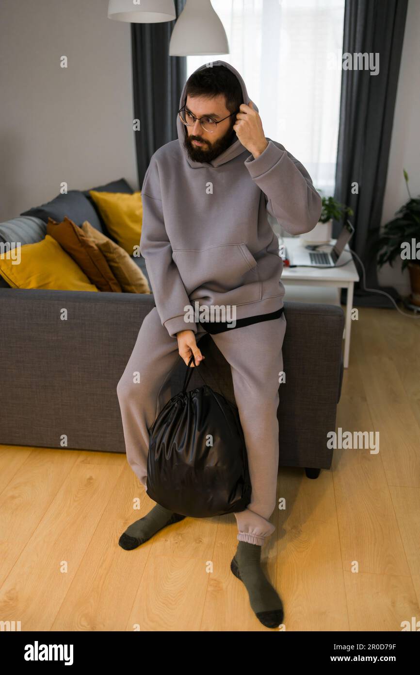 Sad man pondering about his life after a relationship breakup or ...