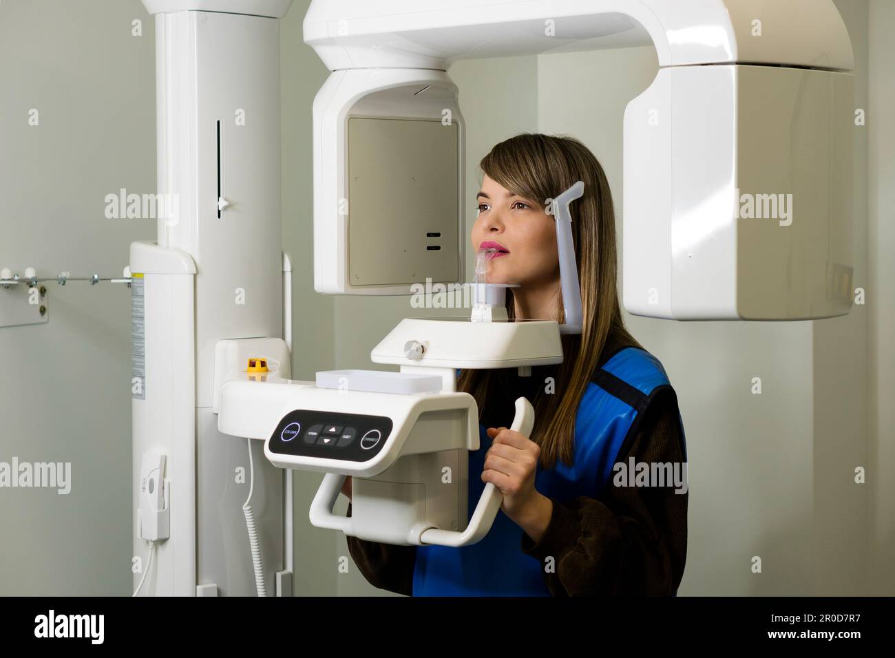 Female patient having computer tomography of jaw, circular snapshot of ...