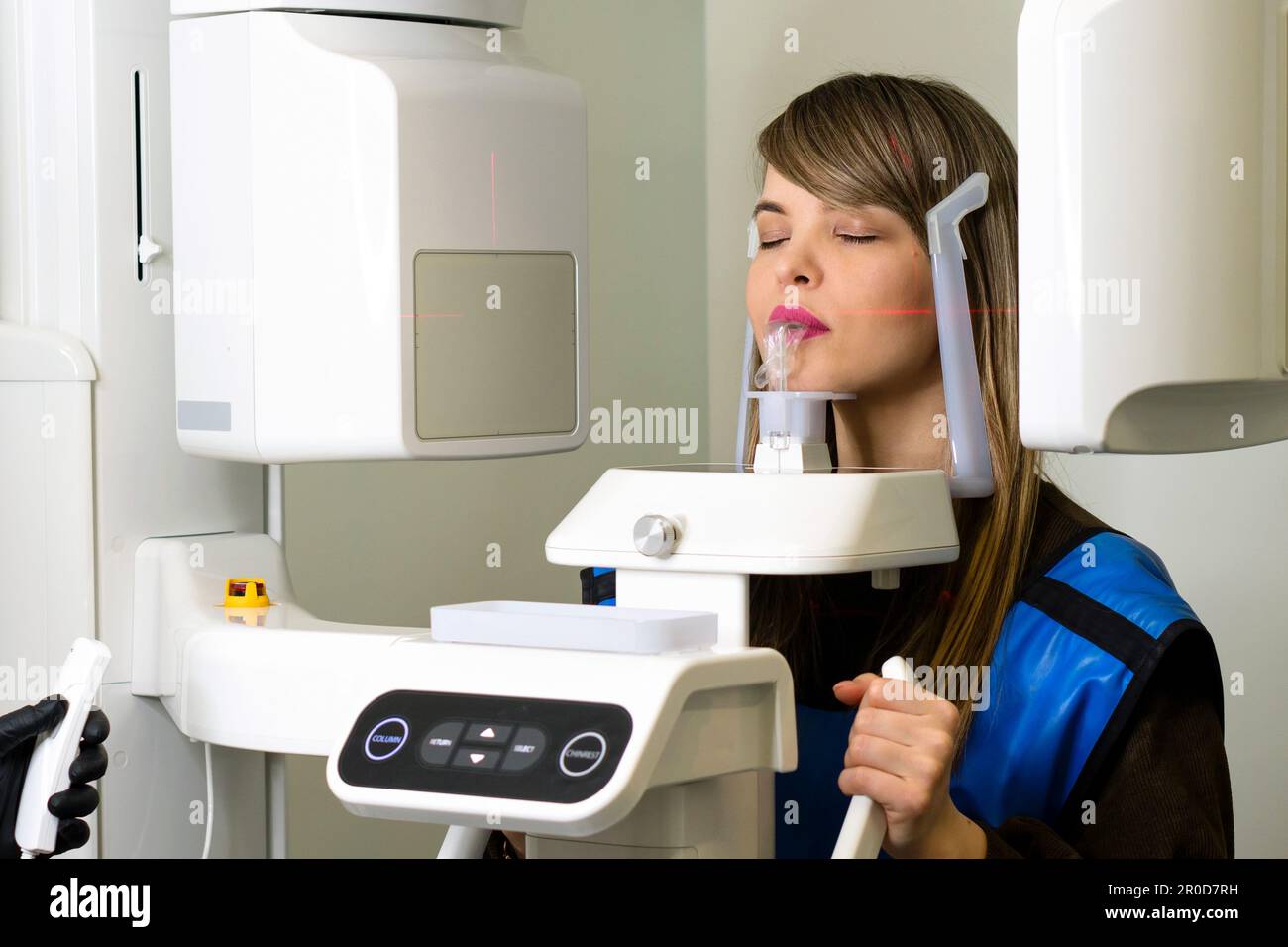 Female patient having computer tomography of jaw, circular snapshot of ...