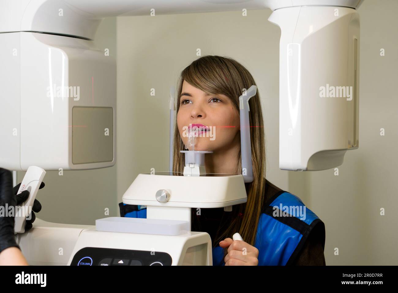 Female patient having computer tomography of jaw, circular snapshot of ...