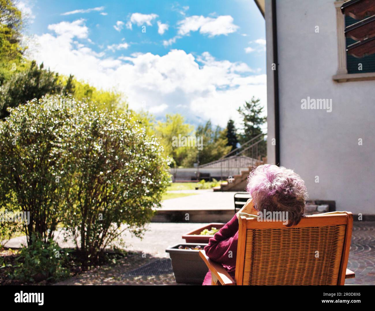 Moment of relaxation surrounded by greenery in the first warm sun of ...