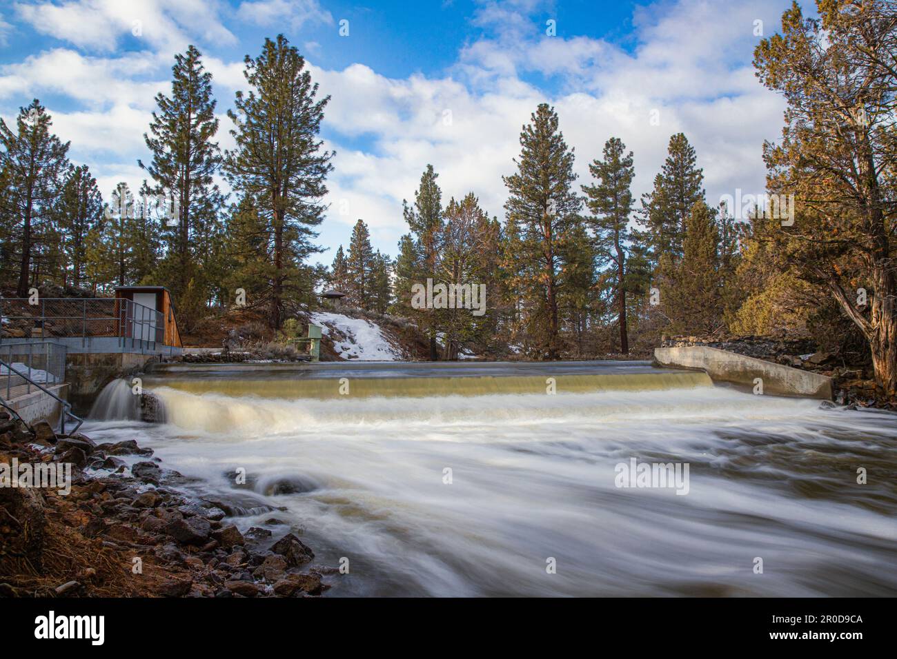 Spring snowmelt water flowing over the Pine Creek Weir near Eagle Lake ...