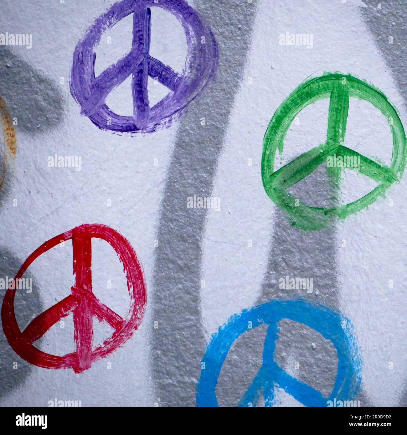 colorful peace symbols painted on a wall Stock Photo - Alamy