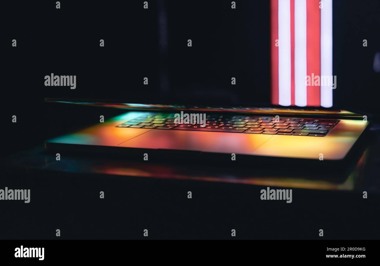 Close up of laptop keyboard colorful neon illumination, backlit ...