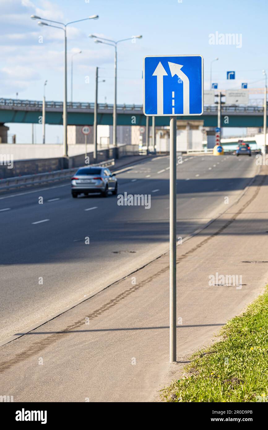 road sign indicating the narrowing of the lane. road sign with an arrow ...