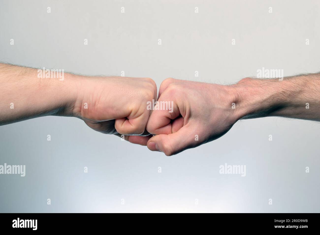 Fist Bump. Clash of two fists. Concept of confrontation Stock Photo - Alamy