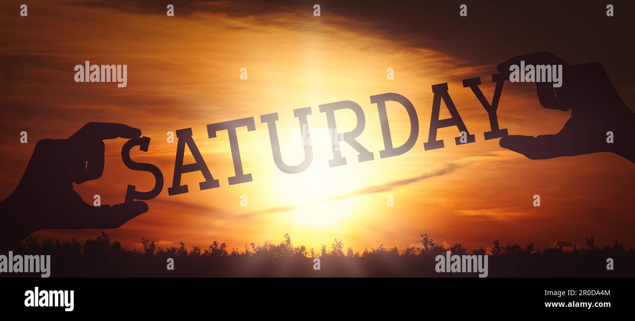 Saturday - human hands holding black silhouette word Stock Photo - Alamy