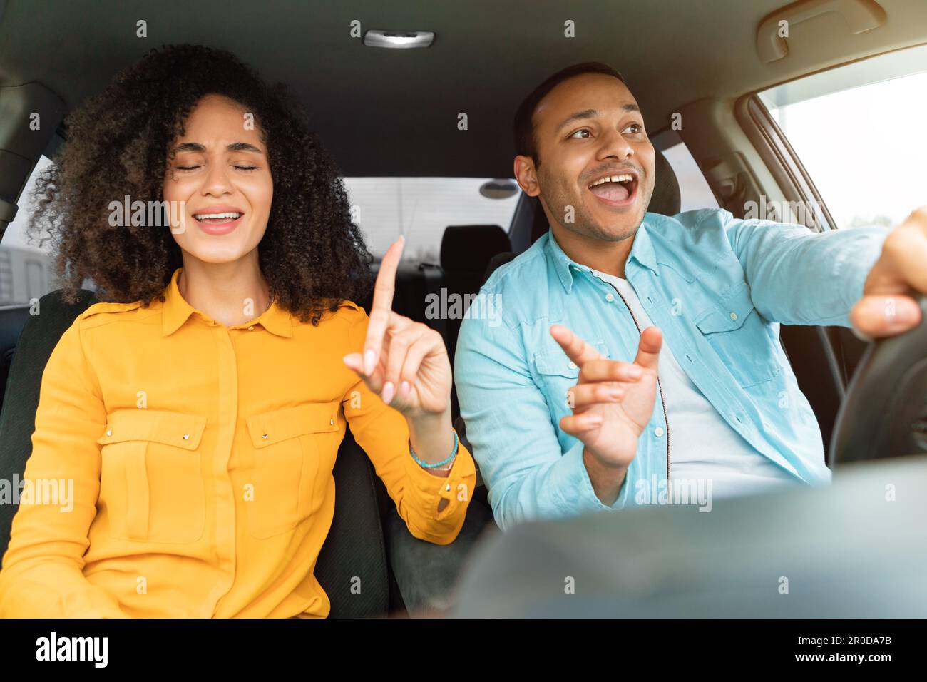 Arabic Couple Enjoying Traveling By Auto And Singing Having Fun Stock ...