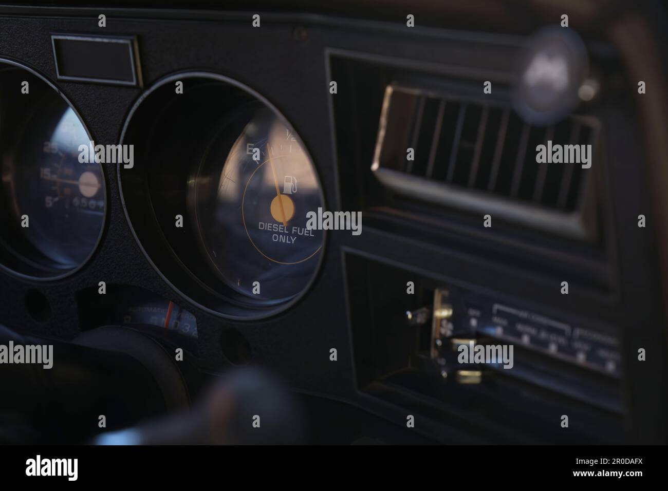 A close-up view of a car dashboard, featuring the fuel indicator Stock ...