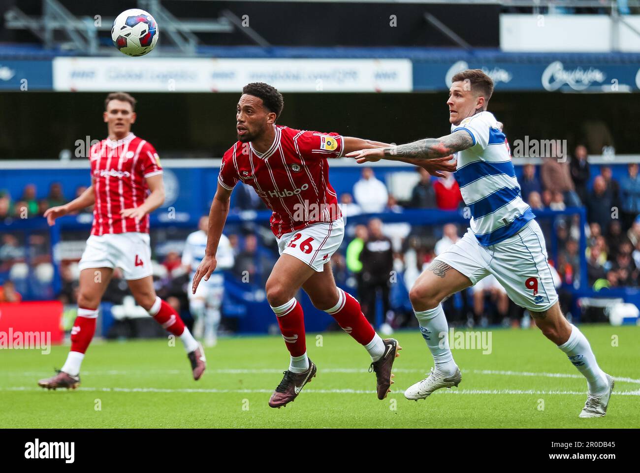 Queens Park Rangers' Lyndon Dykes (right) pulls back on Bristol City's ...