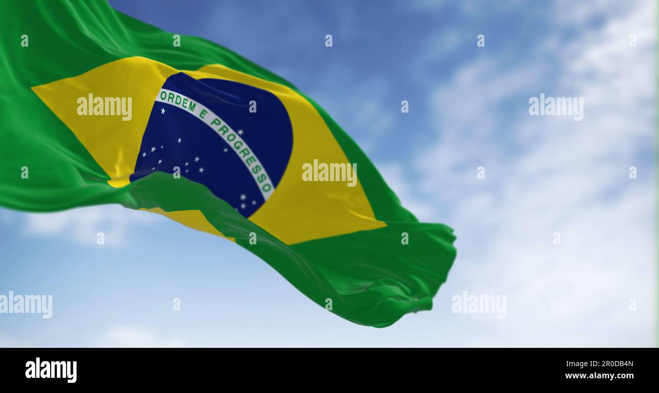 Brazil national flag waving on a clear day. Yellow diamond on green ...