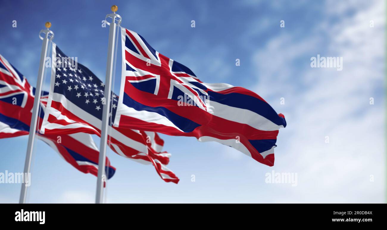 Hawaii state flag waving with the national flag of the United States of ...