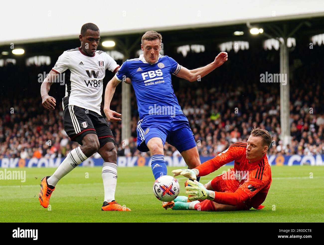 Fulham goalkeeper Bernd Leno fouls Leicester City's Jamie Vardy (centre ...