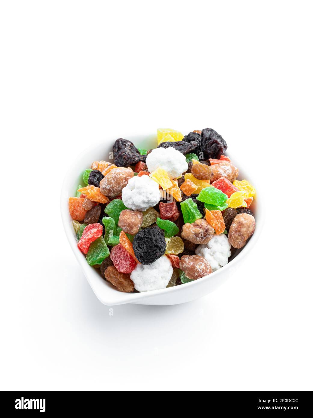 Sugar coated nuts and candied fruit in white plate isolated on white ...