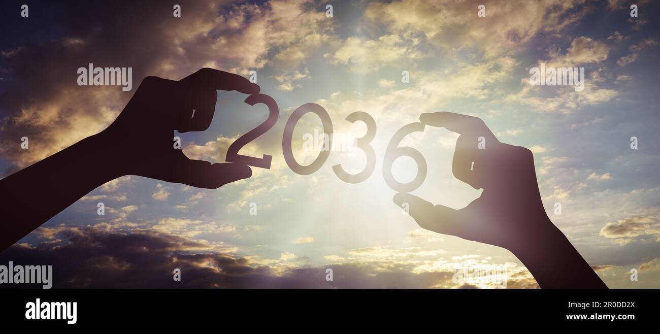 2036 - human hands holding black silhouette year number Stock Photo - Alamy