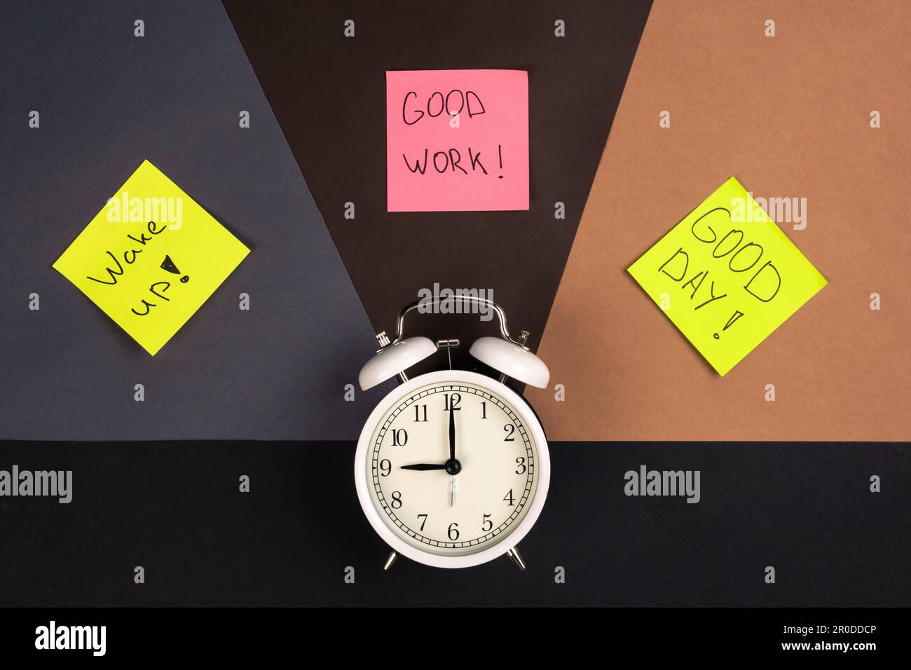 Alarm clock and stickers with motivational inscriptions, top view Stock ...