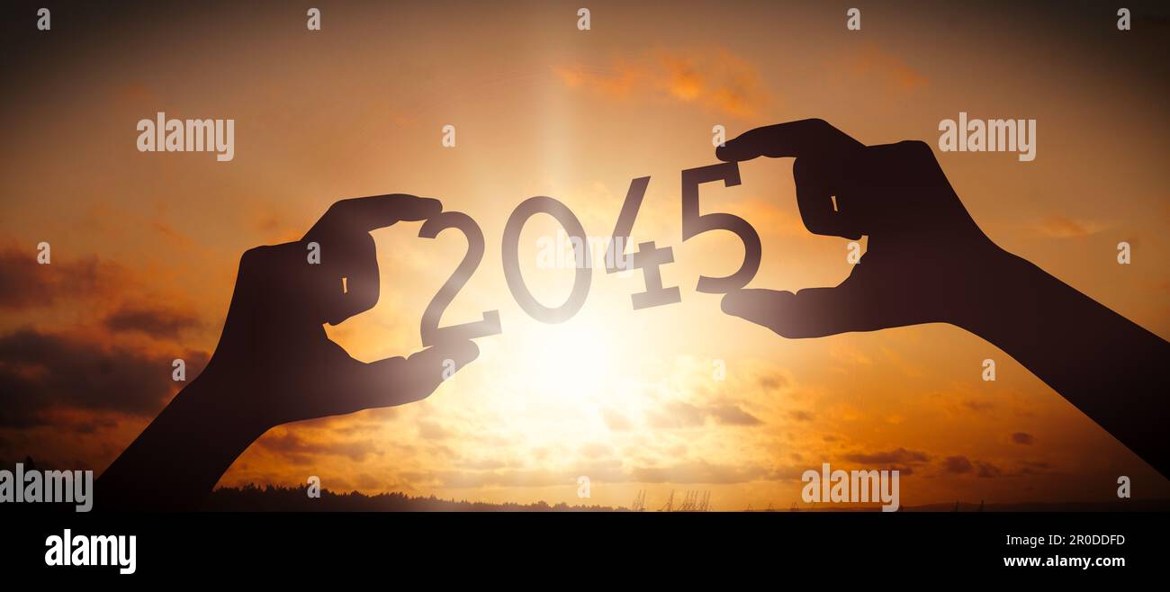 2045 - human hands holding black silhouette year number Stock Photo - Alamy