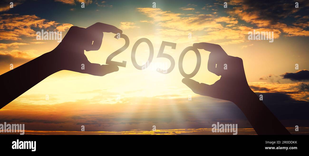 2050 - human hands holding black silhouette year number Stock Photo - Alamy