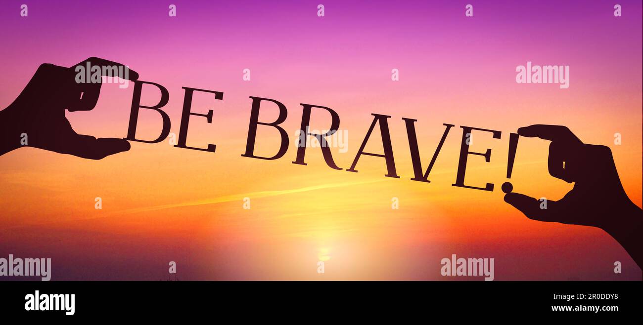 Be brave - human hands holding black silhouette words Stock Photo - Alamy