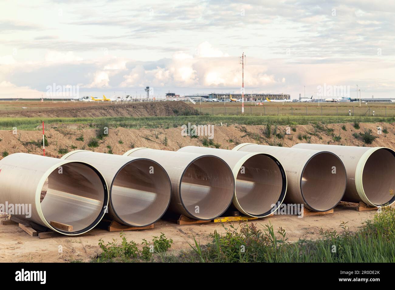 Stack of big frp composite fiberglass plastic sewage pipes at warehouse ...