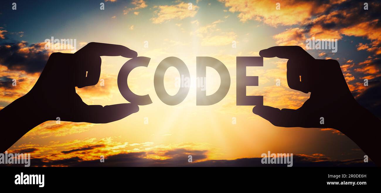 Code - human hands holding black silhouette word Stock Photo - Alamy