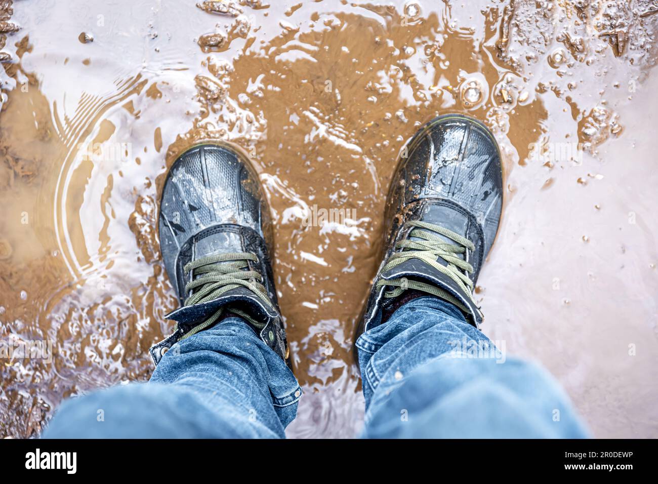 View from above on pair of trekking shoes in a mud Stock Photo - Alamy