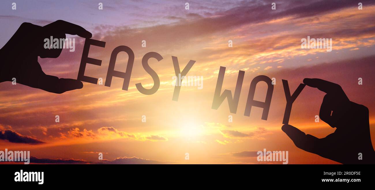 Easy way - human hands holding black silhouette words Stock Photo - Alamy