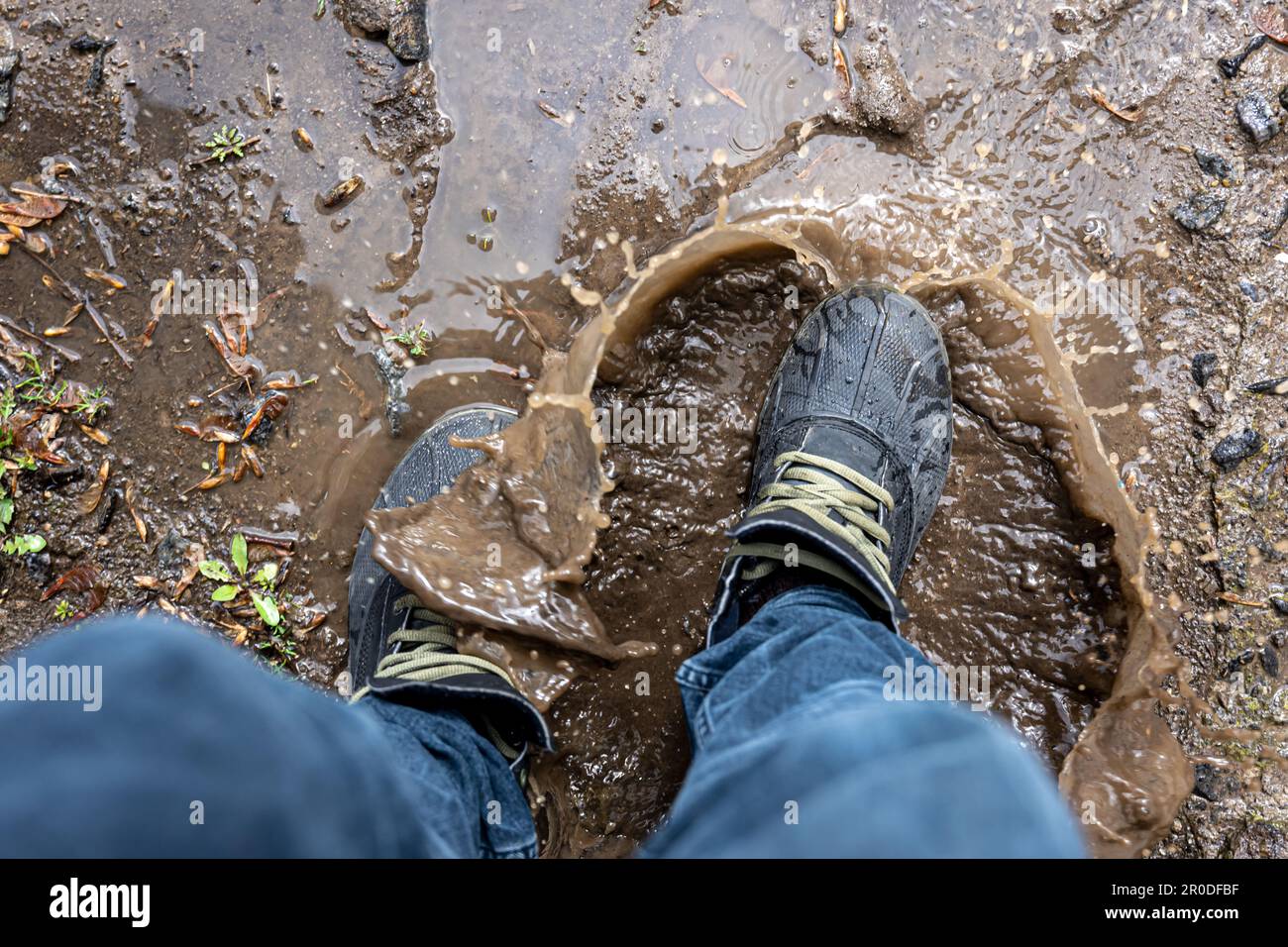 Pair of sneakers in mud hi-res stock photography and images - Alamy