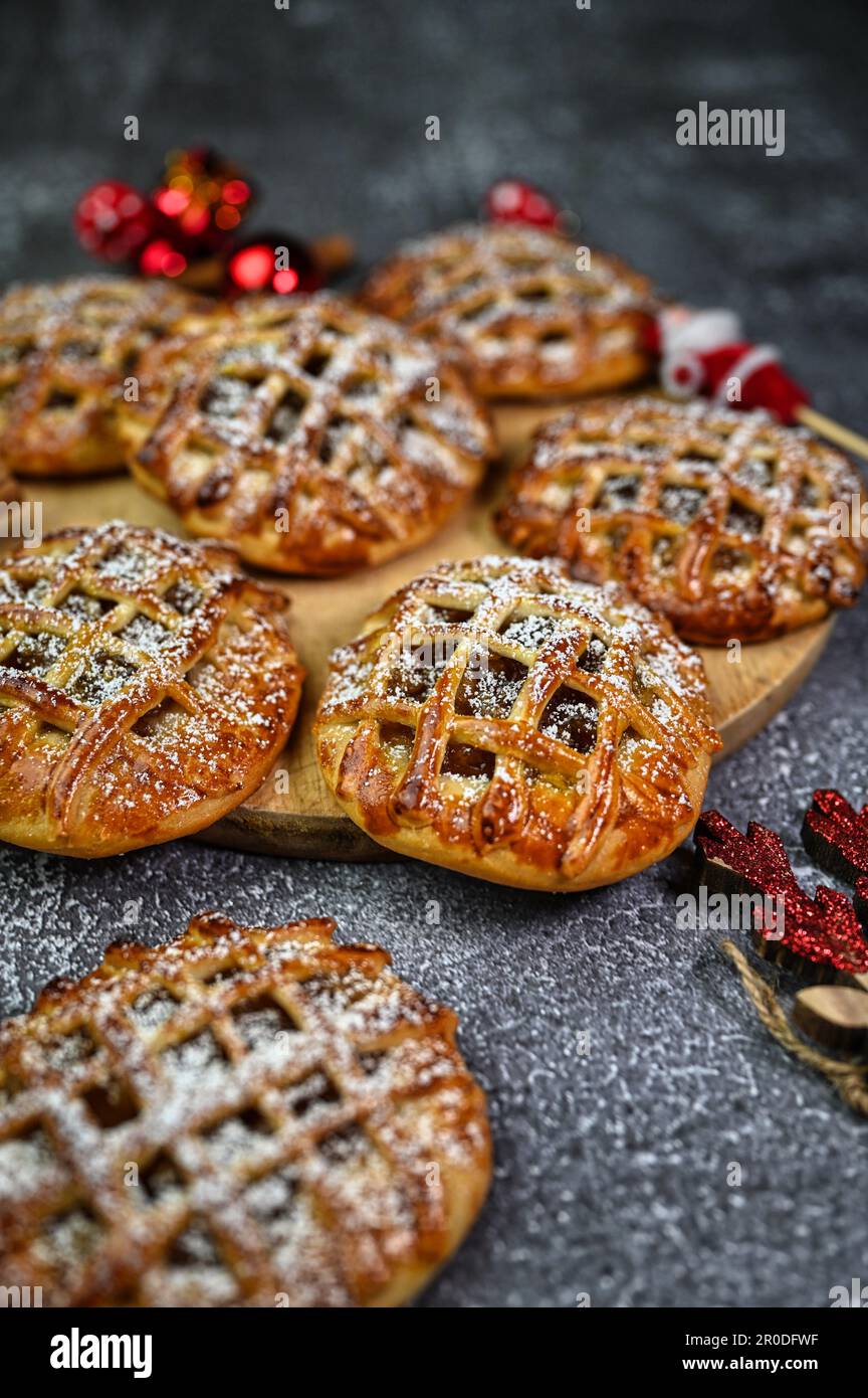 A vertical image of freshly-baked Apple crumble cookies decorated for ...