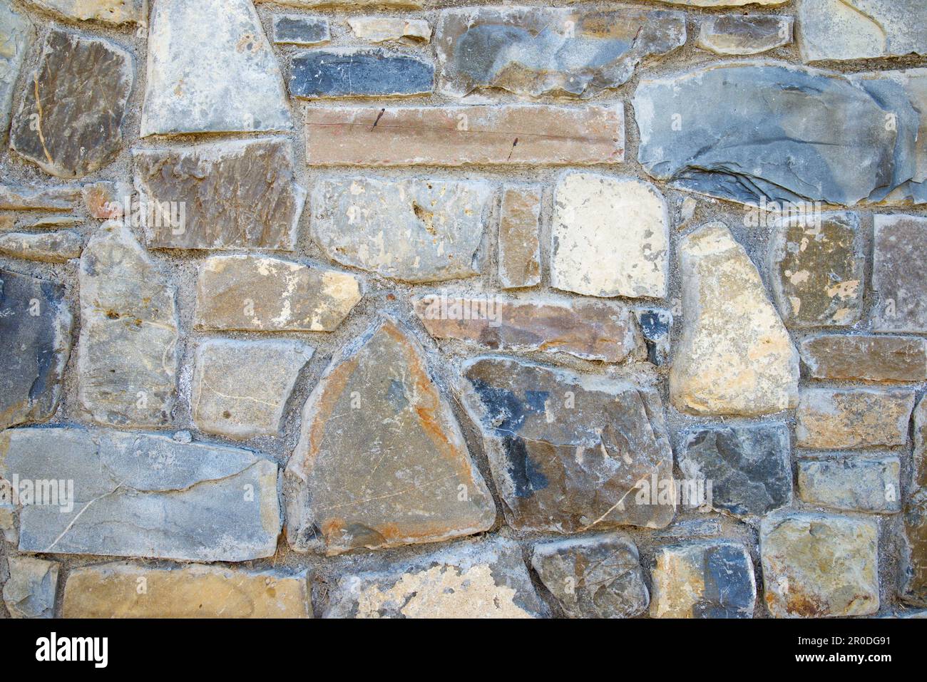 Texture of an old stone wall in Spain Stock Photo - Alamy