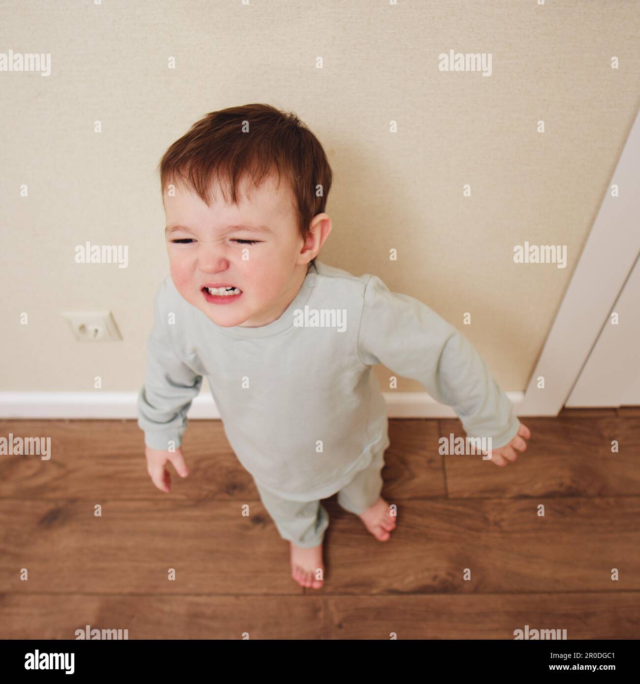 Little baby whimpers and is naughty. Small child is crying and ...