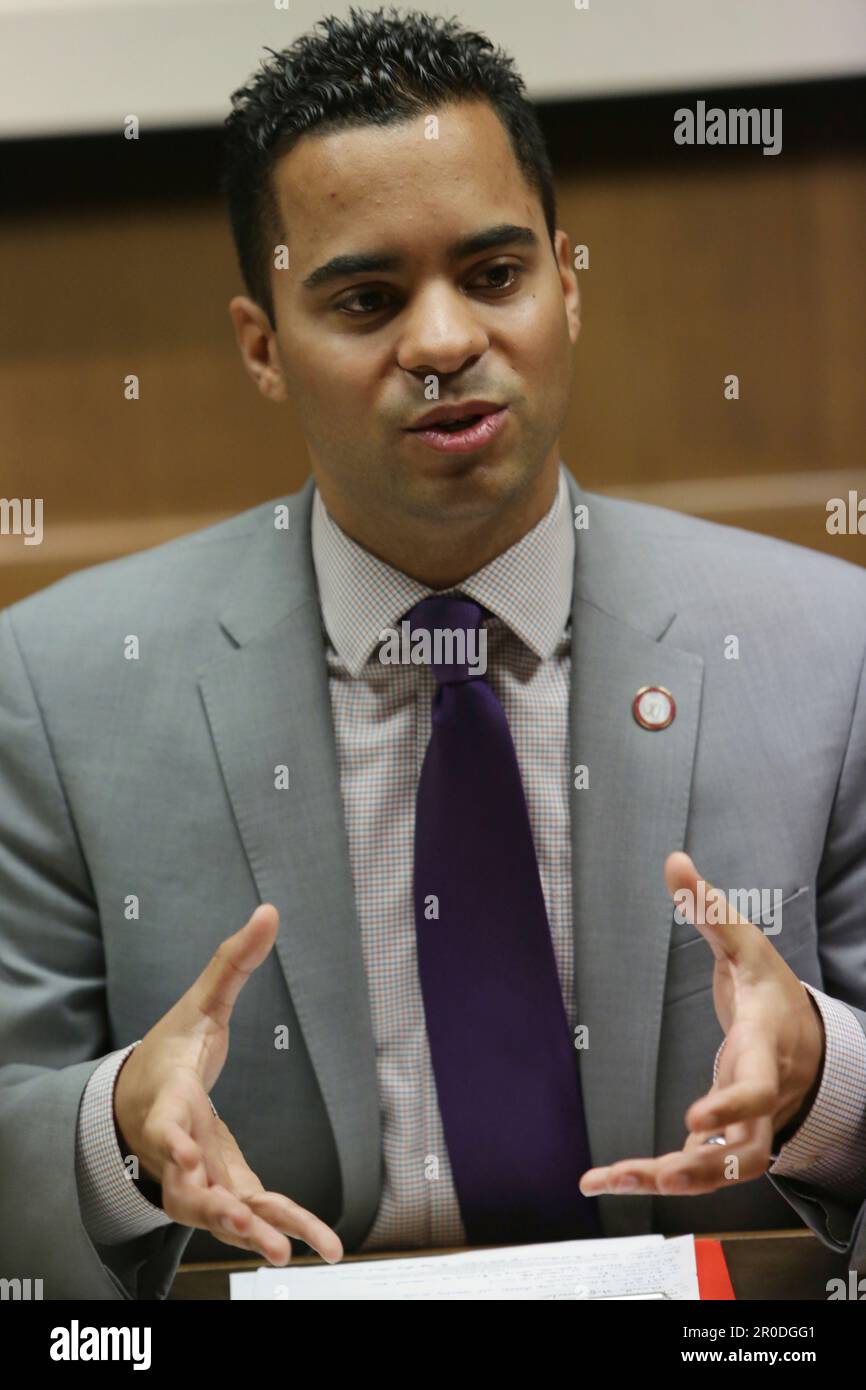 Incumbent Community College Board candidate Alex Randolph speaks with ...