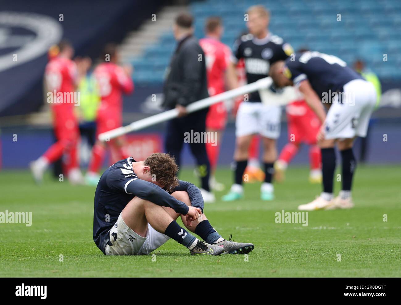 Millwall's Callum Styles sits dejected after missing out on the play ...