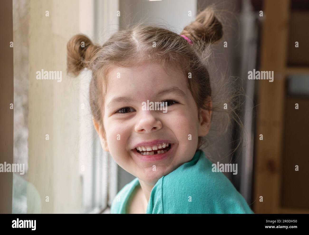 Portrait of a happy little girl 4-5 years old smiling. Diverse kids ...