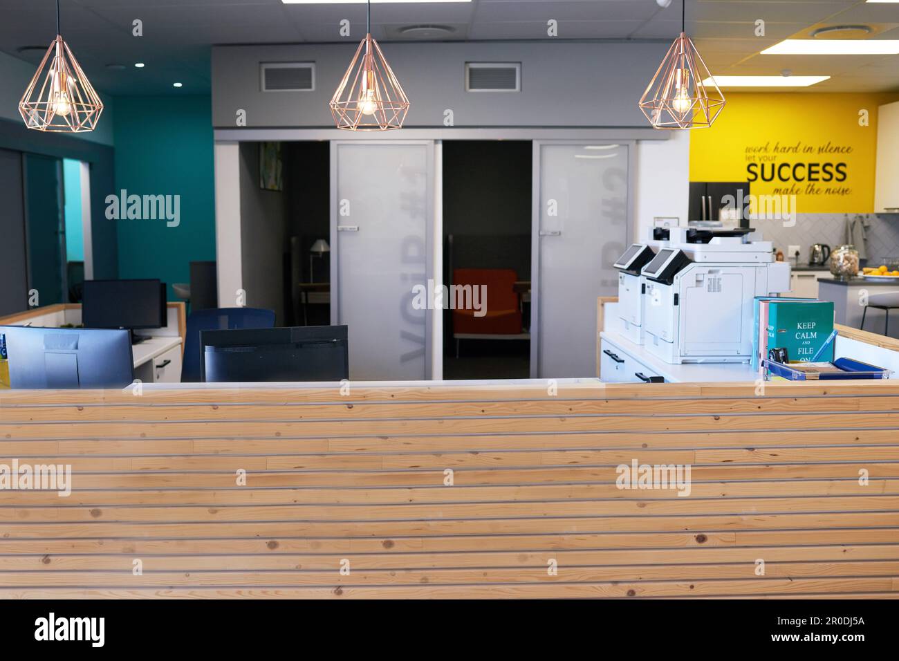 Empty reception desk with wooden front, coworking office space Stock ...