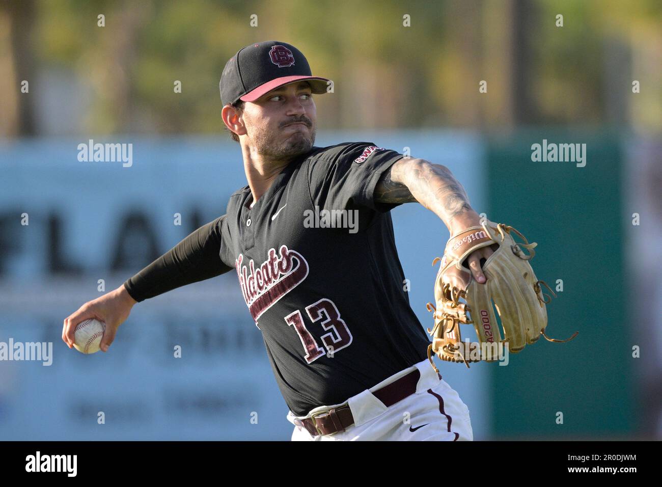 Bethune-Cookman infielder Brian Perez (13) throws during an NCAA ...