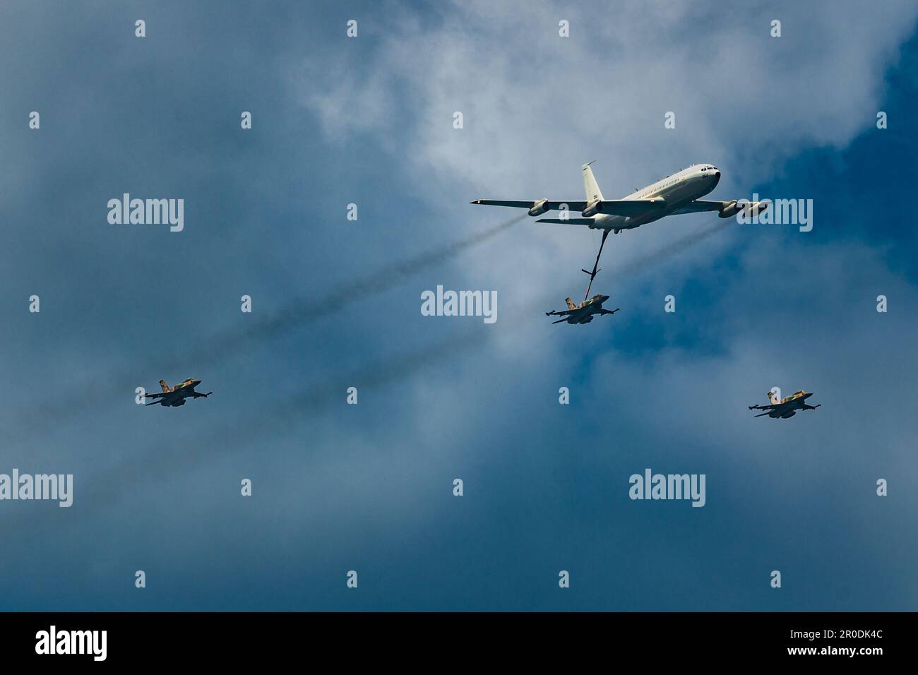 Three jets flying in a formation near an airplane Stock Photo - Alamy