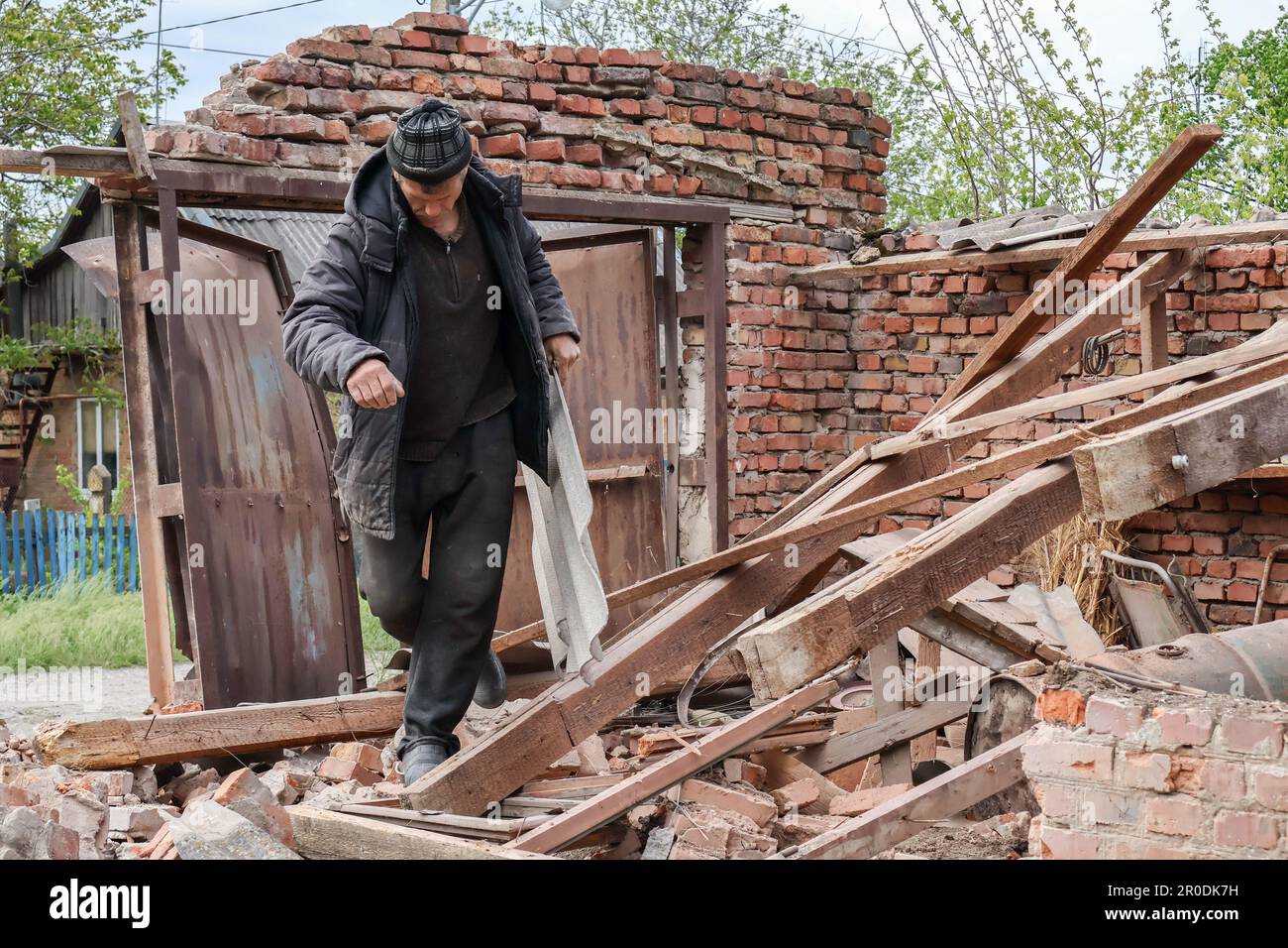 Komyshevakha, Ukraine. 08th May, 2023. Local resident clear the rubble ...
