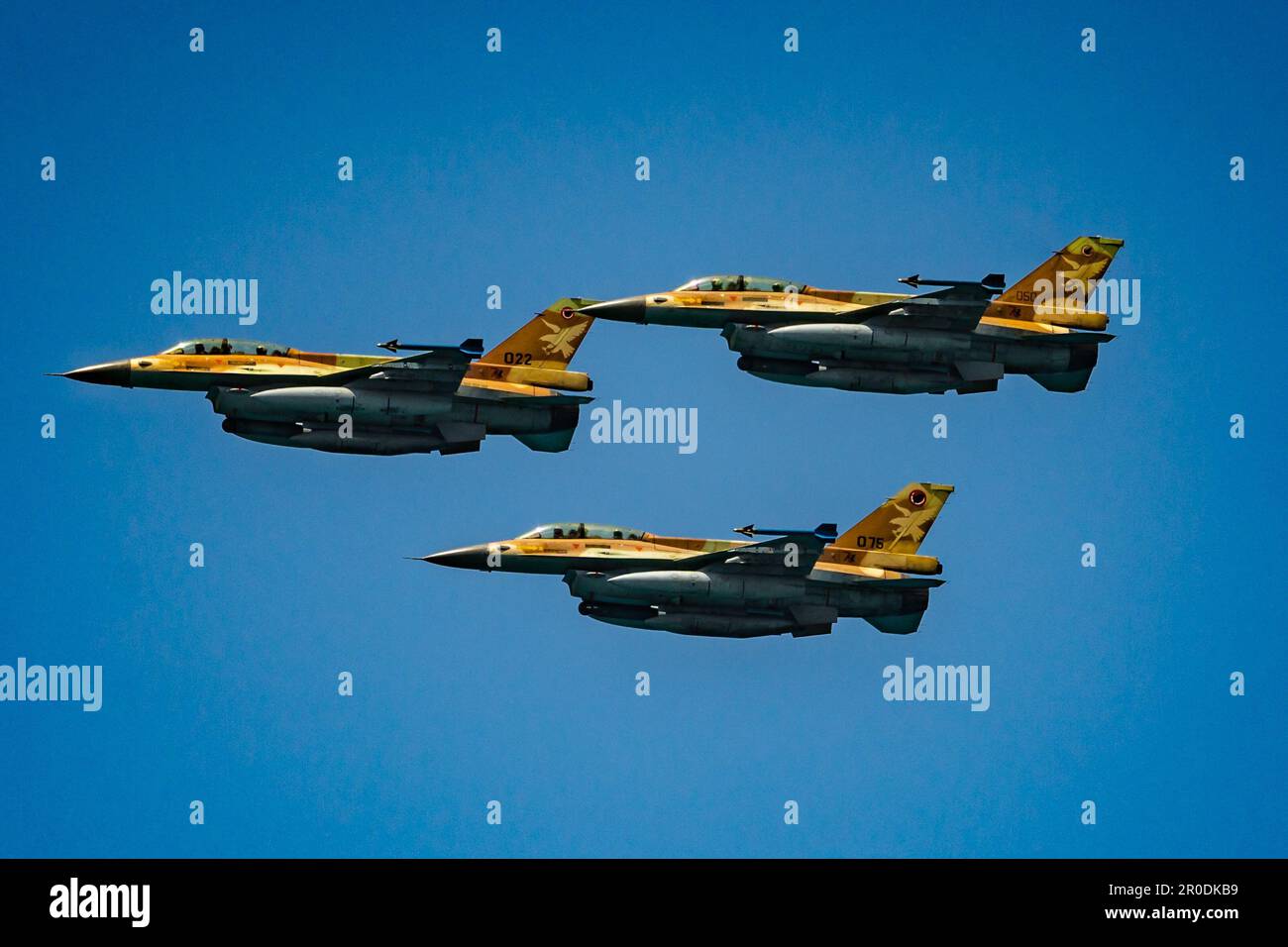 Three jet planes fly in formation against the backdrop of Tel Aviv ...
