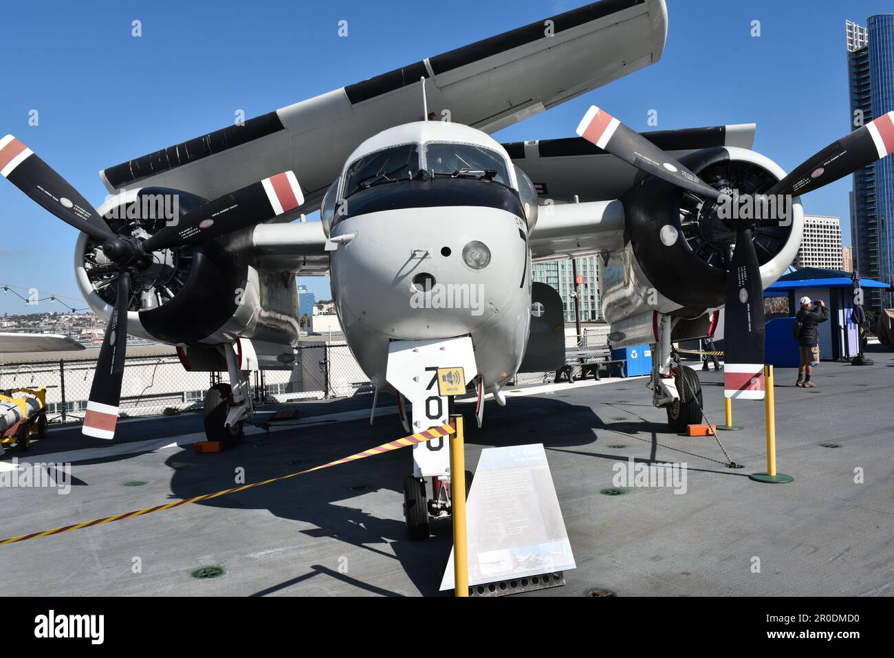 A military airline jet parked on the tarmac of an airport with a speed ...