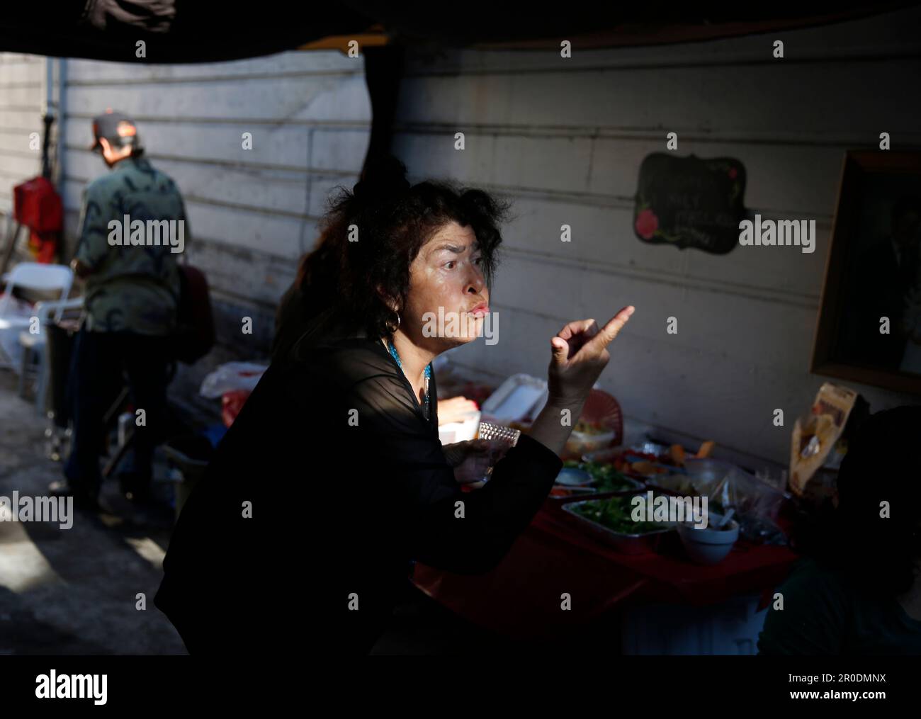 Maria Mosqueda jokes with guests during the Mosqueda family farewell ...