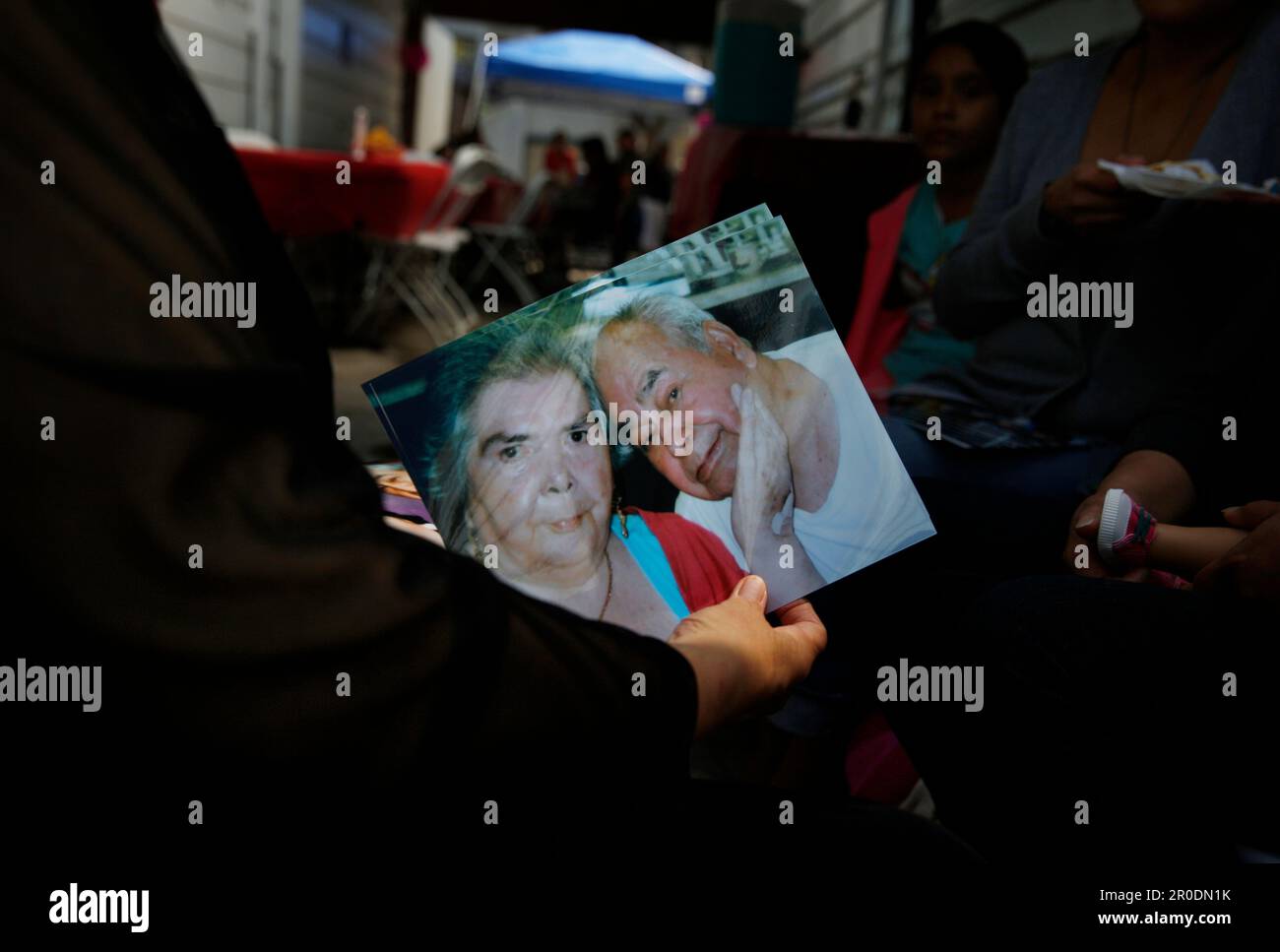 Maria Mosqueda holds one of the last portraits taken of her parents ...